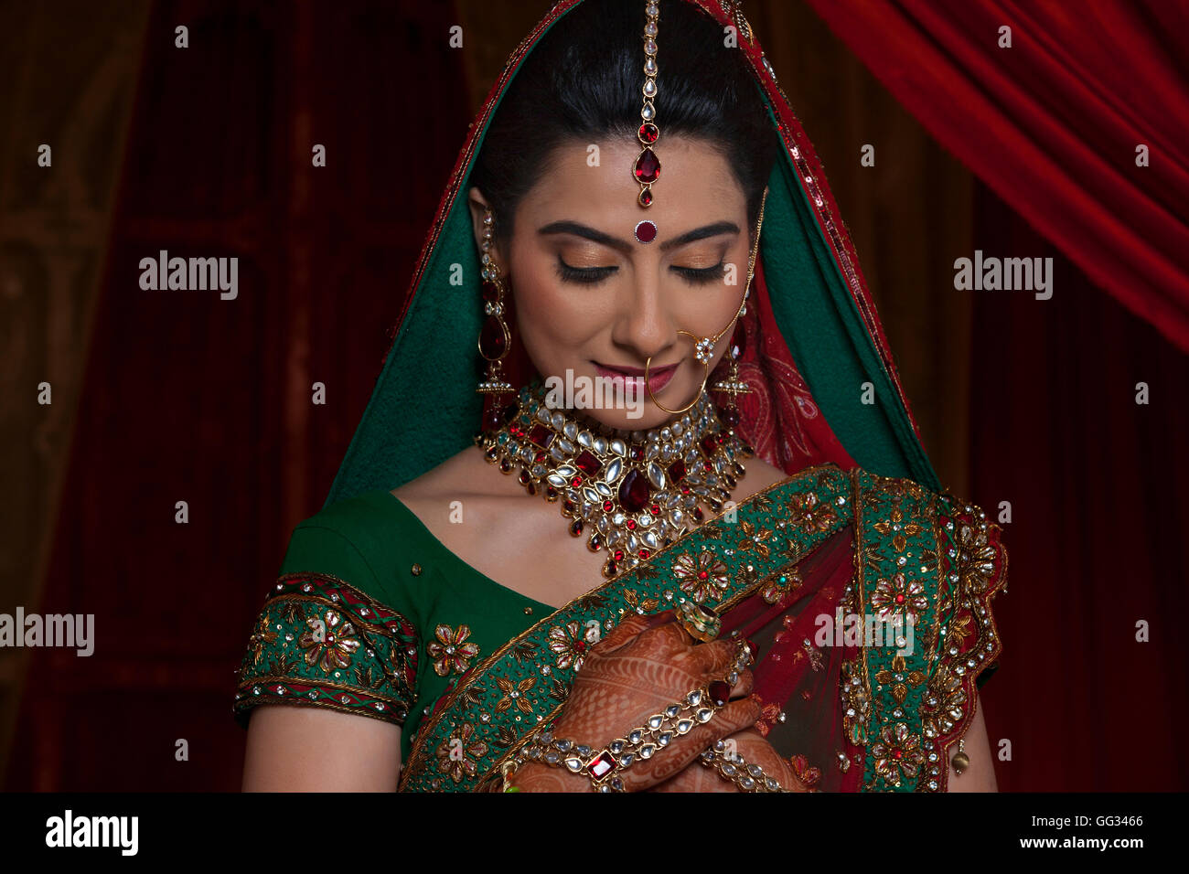 Front view of young Indian bride looking down Stock Photo - Alamy