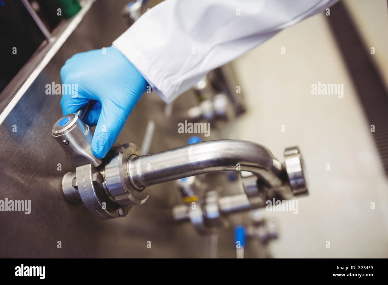 Hand holding pipe hi-res stock photography and images - Alamy
