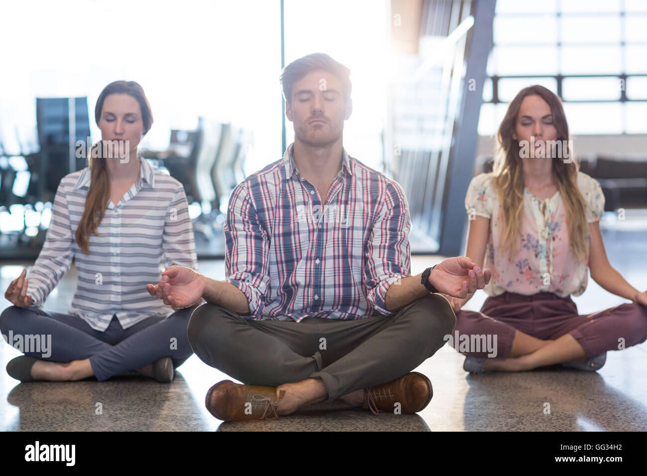 People sitting on floor meditating hi-res stock photography and images ...