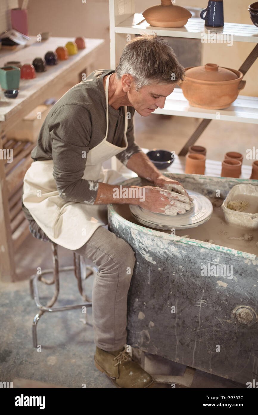 Male potter making pot in hi-res stock photography and images - Alamy