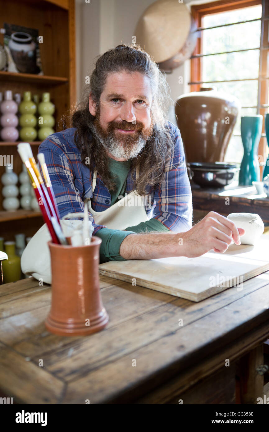 Portrait of male potter in pottery workshop Stock Photo - Alamy