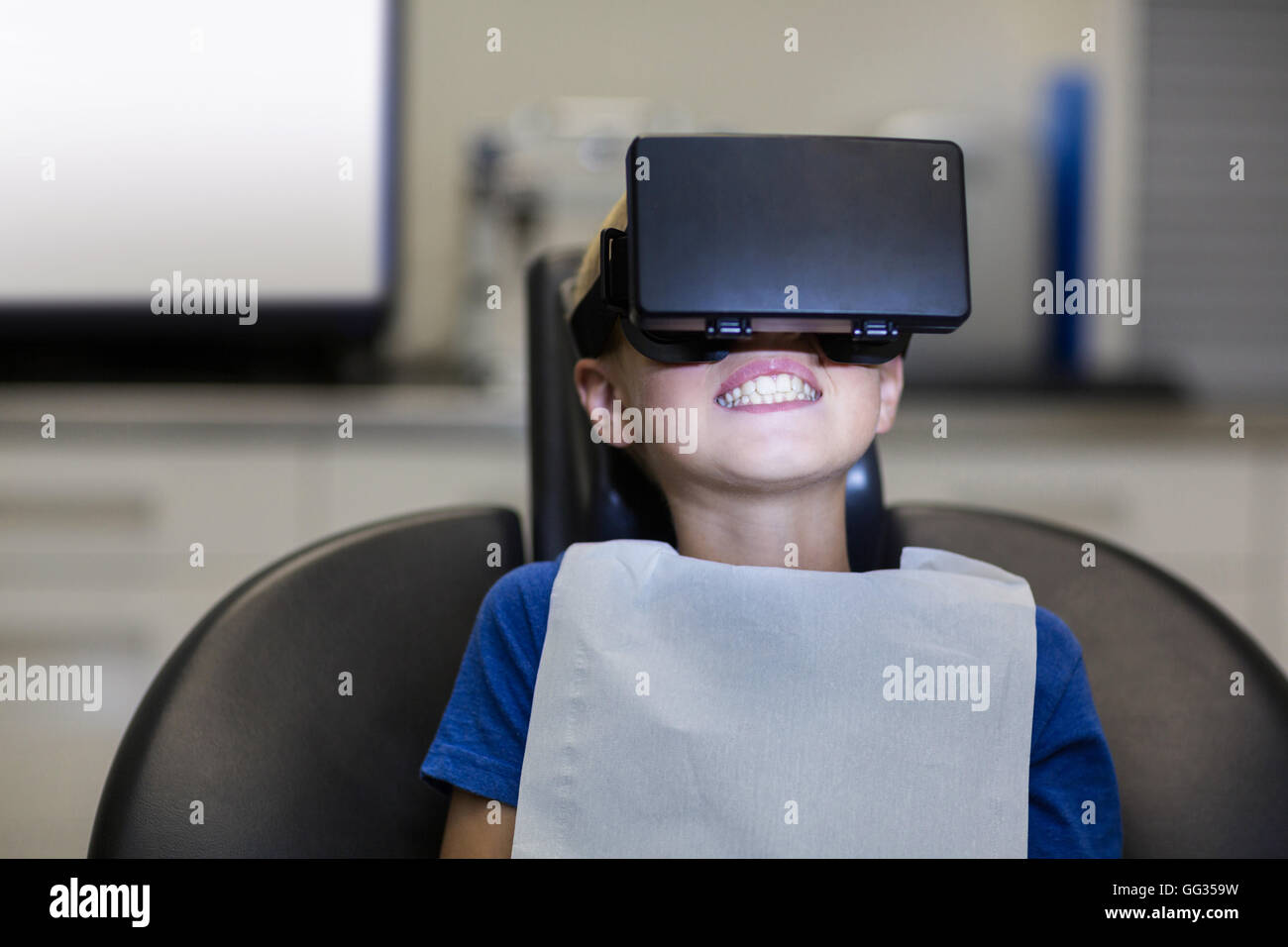 Boy using virtual reality headset during a dental visit Stock Photo - Alamy