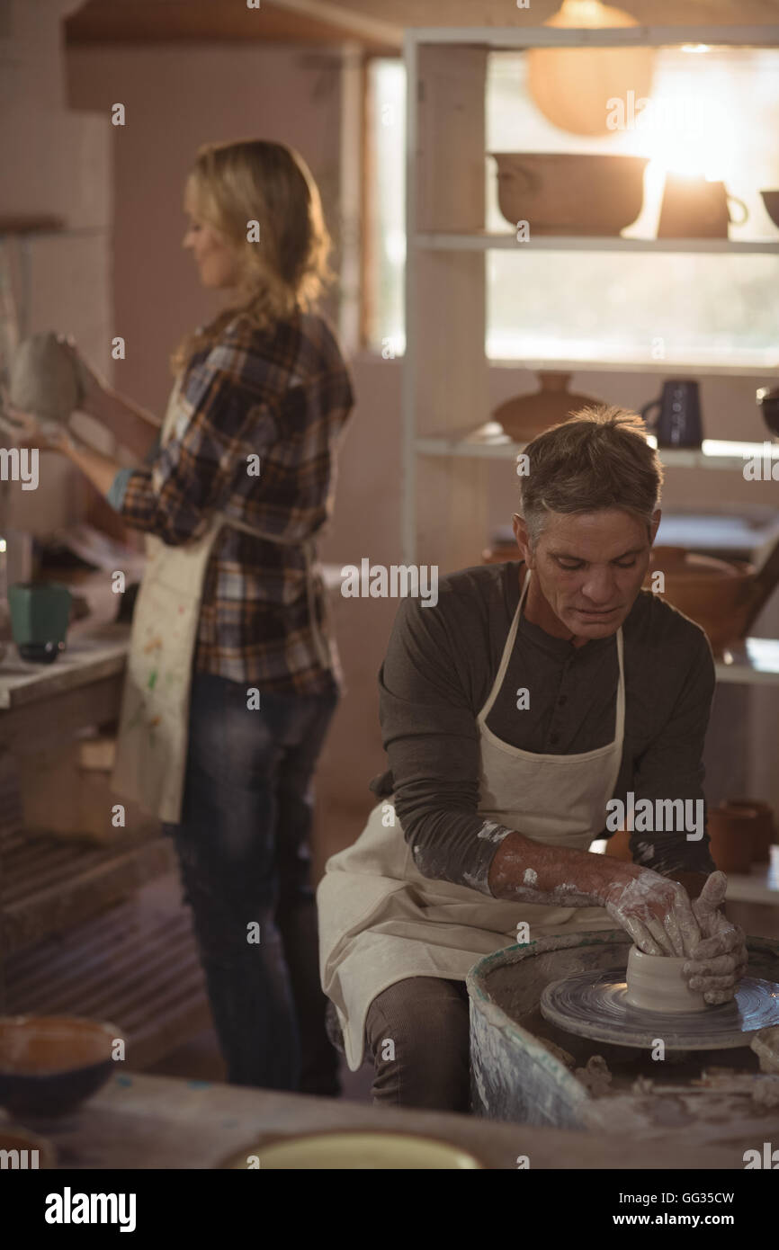 Male potter making pot in pottery workshop Stock Photo - Alamy
