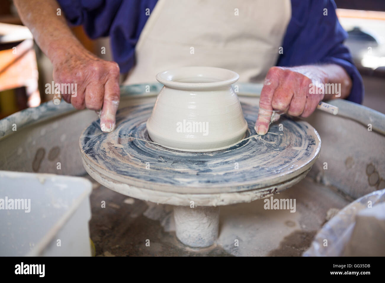 Mid section of potter making pot Stock Photo - Alamy