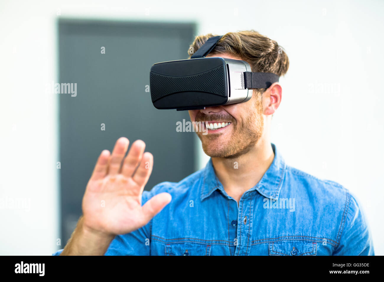 Happy young man virtual reality hi-res stock photography and images - Alamy