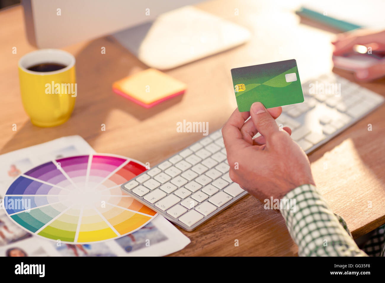 Graphic designer doing online shopping Stock Photo - Alamy