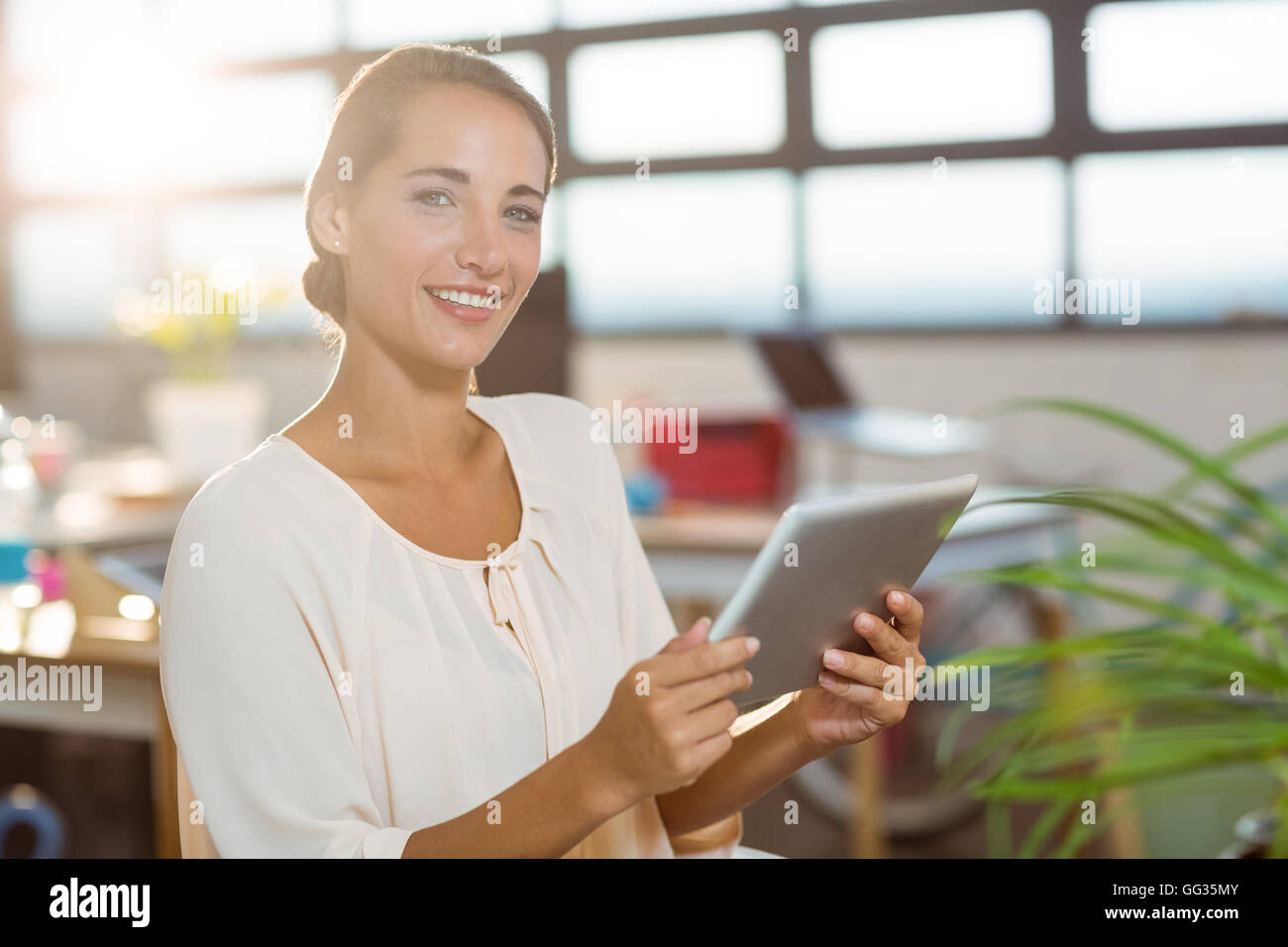 Business executive holding digital tablet Stock Photo - Alamy