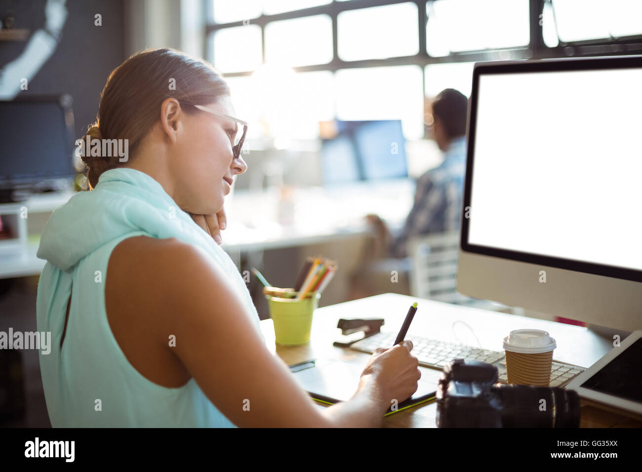 Graphic designer using graphics tablet Stock Photo - Alamy