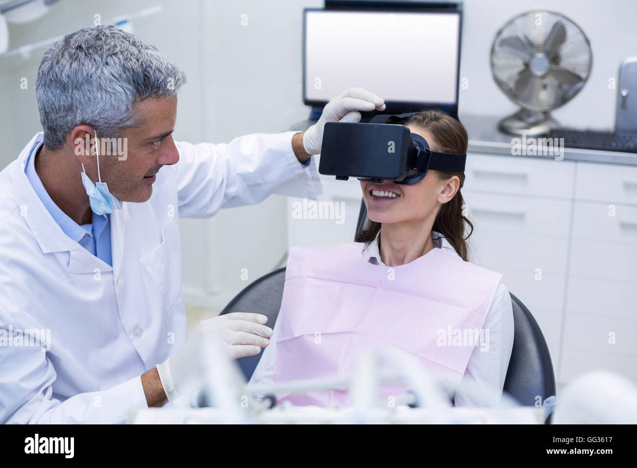 Female patient virtual reality headset during a dental visit Stock ...