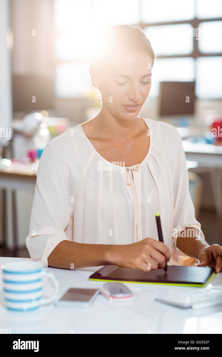 Businesswoman using graphic tablet Stock Photo - Alamy