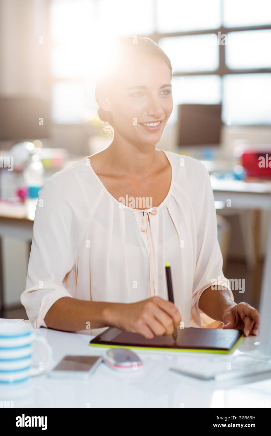 Businesswoman using graphic tablet Stock Photo - Alamy