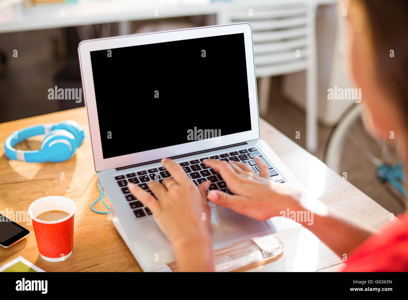 Business executive using laptop Stock Photo - Alamy