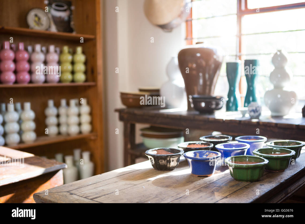 Various pottery on table Stock Photo - Alamy