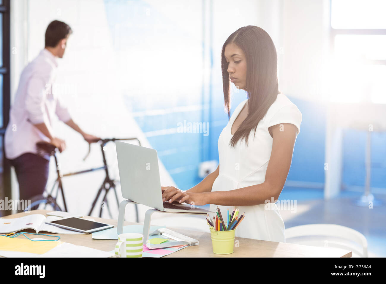 Business executive using laptop Stock Photo - Alamy