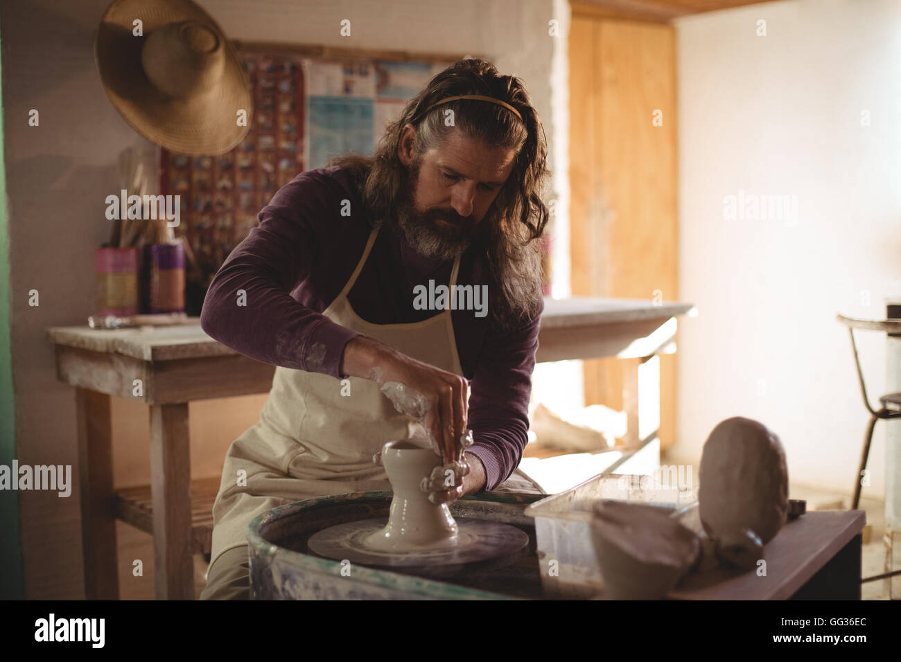Male potter making pot Stock Photo - Alamy