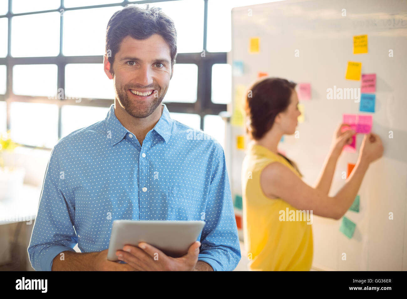 Business executive holding digital tablet Stock Photo - Alamy