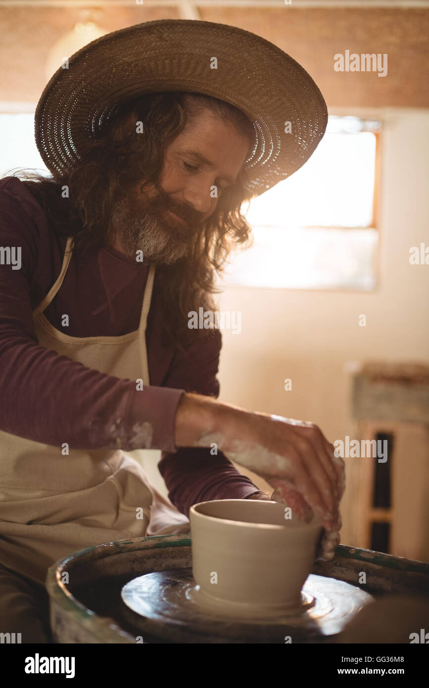 Male potter making pot Stock Photo - Alamy
