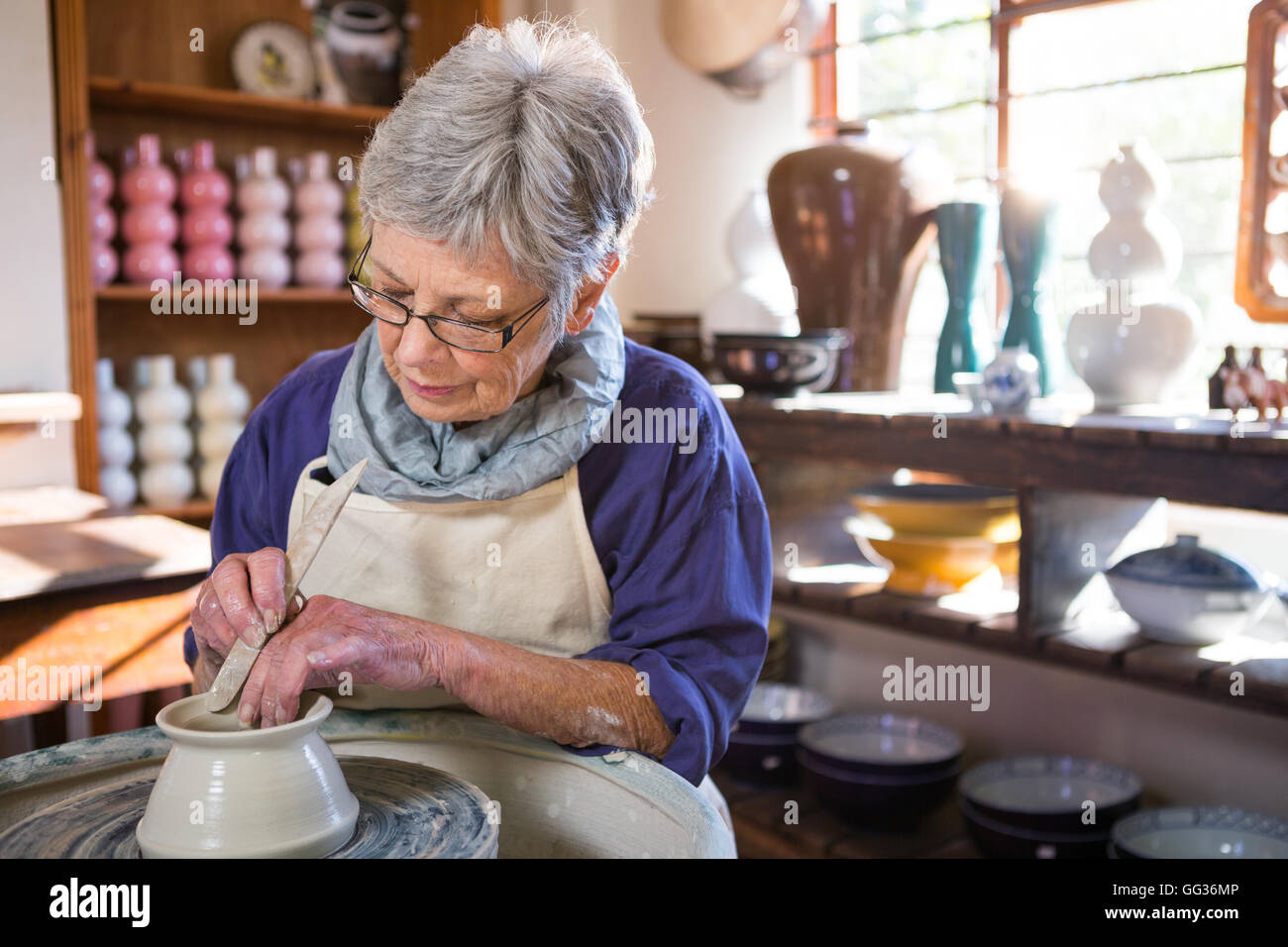 Female potter making pot Stock Photo - Alamy
