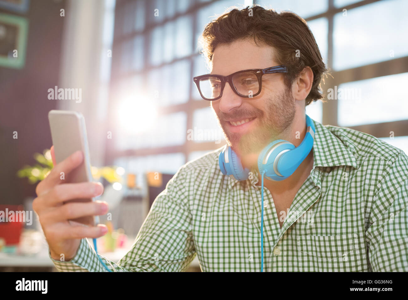 Graphic designer using mobile phone Stock Photo - Alamy