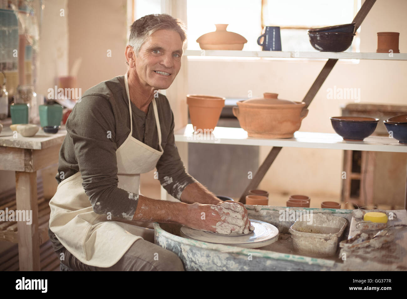 Man creating pottery hi-res stock photography and images - Alamy