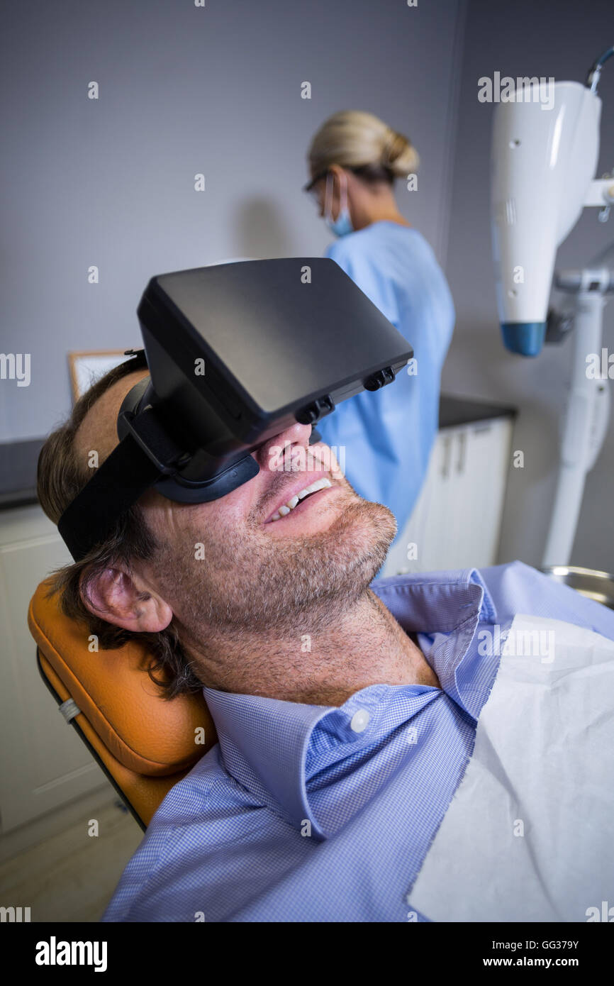 Smiling man using virtual reality Stock Photo - Alamy