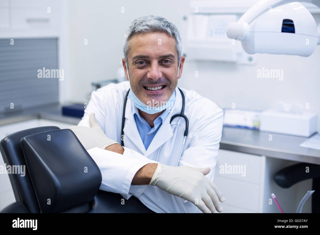 Portrait of a smiling dentist Stock Photo - Alamy