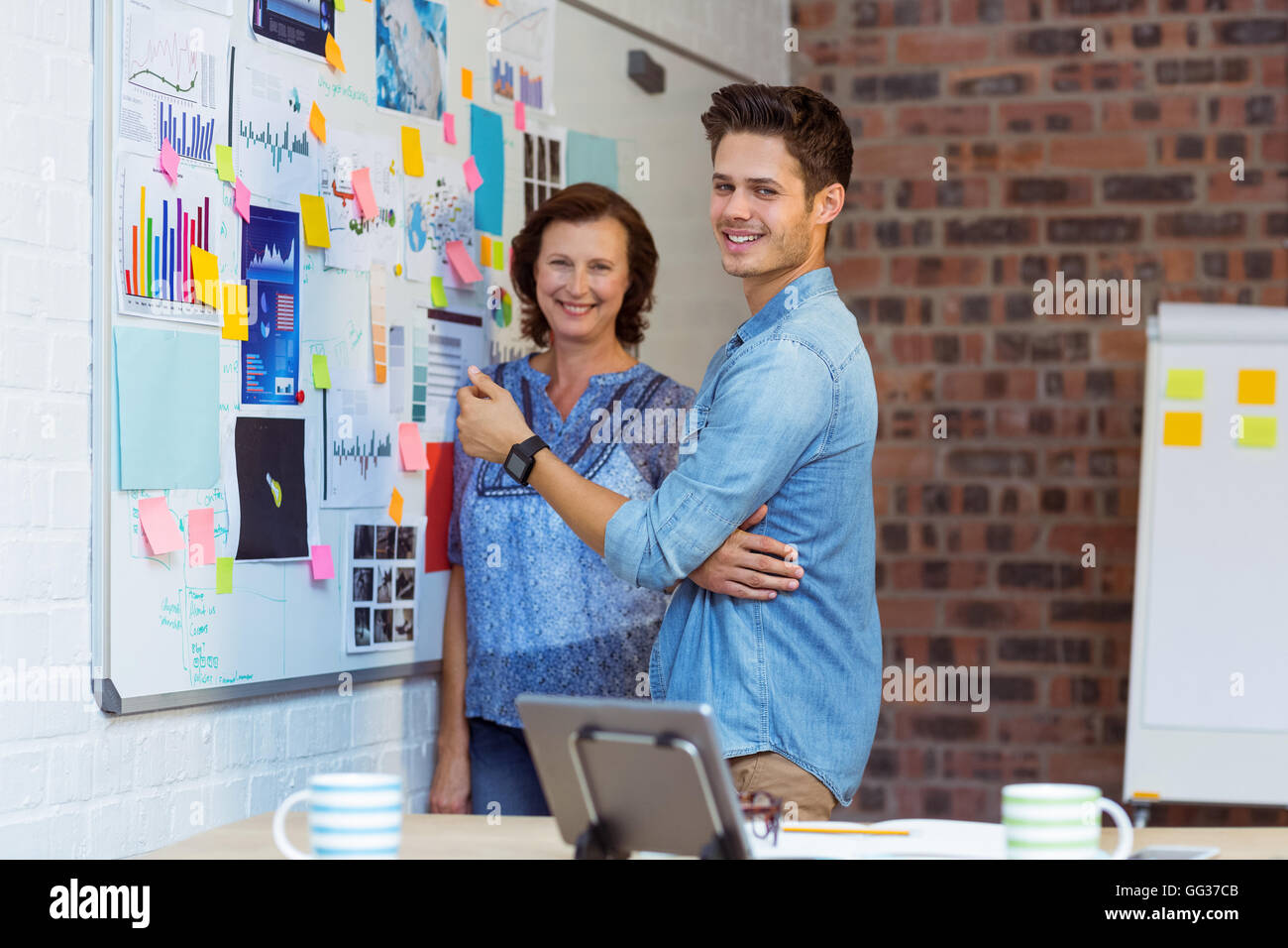 Business people standing near whiteboard Stock Photo - Alamy