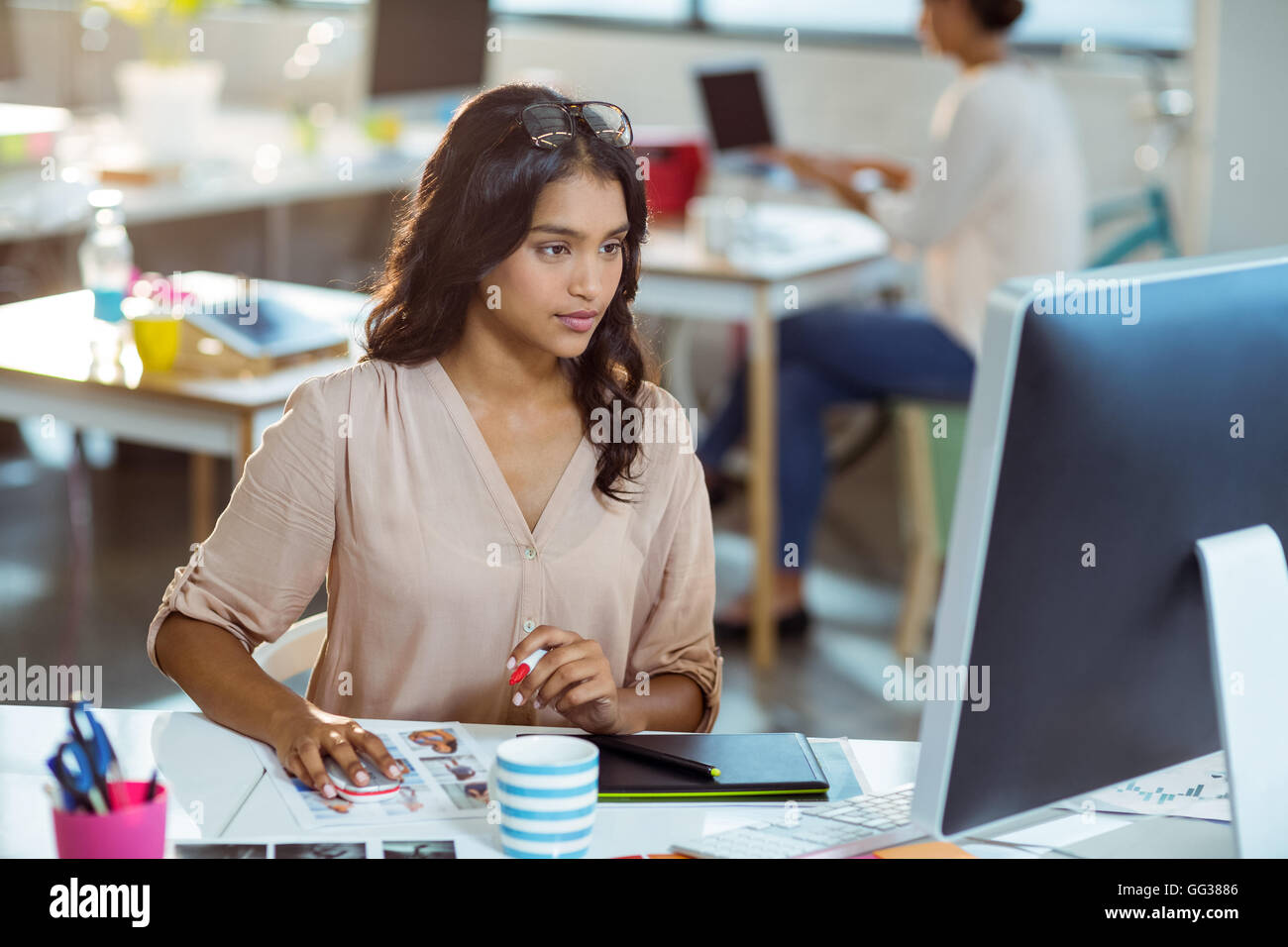 Businesswoman using graphic tablet Stock Photo - Alamy