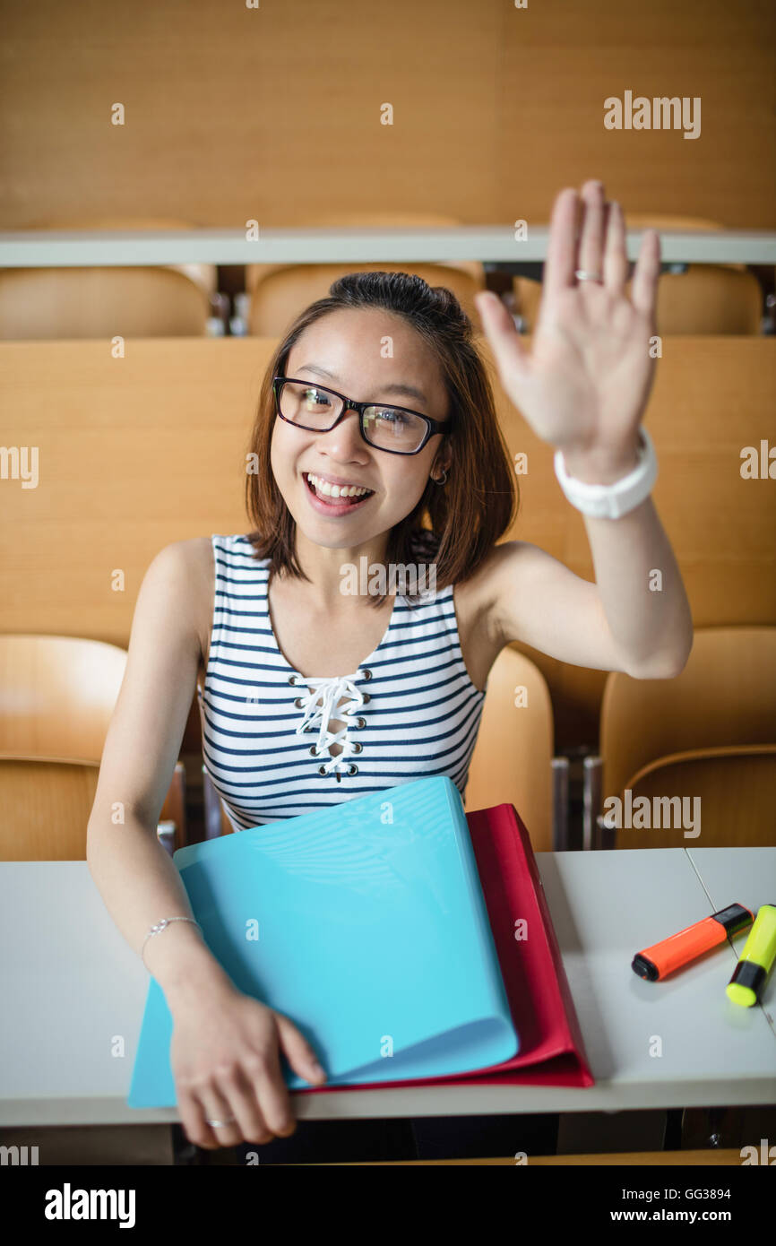 Happy woman raising hand hi-res stock photography and images - Alamy