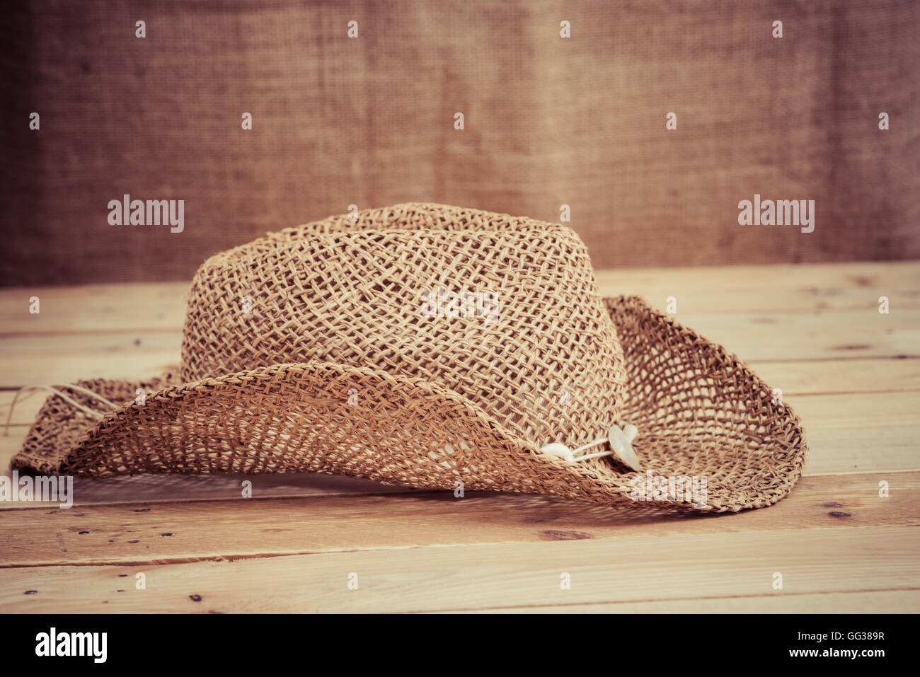 Vintage hat on grunge wooden floor with Sackcloth texture background ...