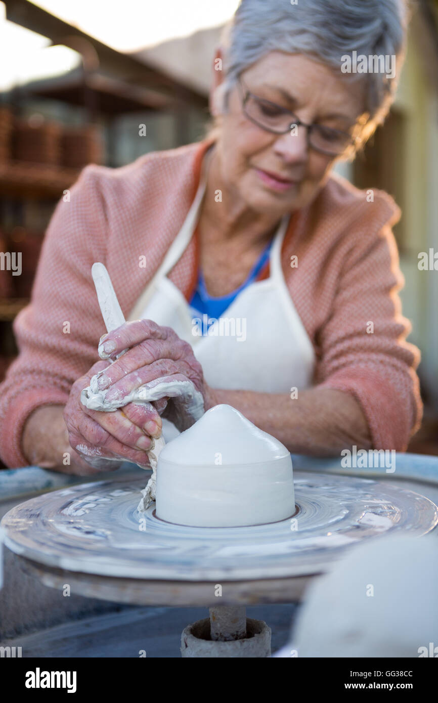 Female potter making pot Stock Photo - Alamy