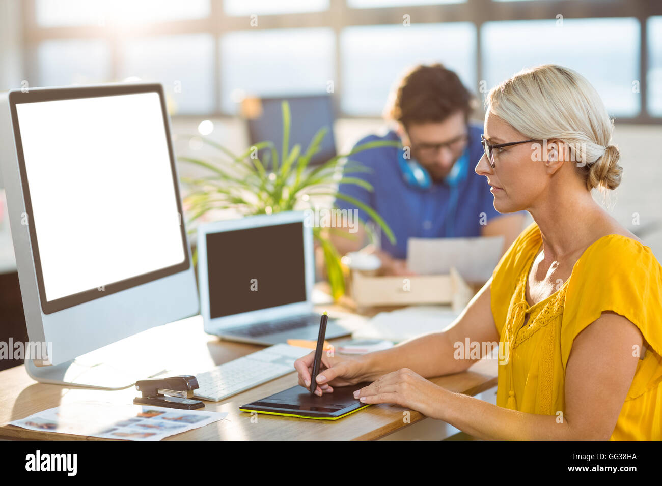 Graphic designer using graphics tablet Stock Photo - Alamy