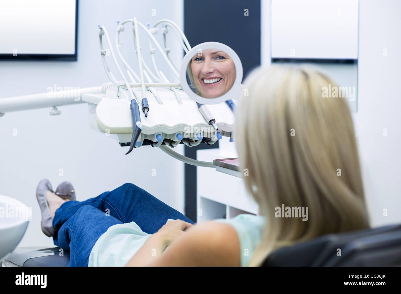 Pretty female patient smiling Stock Photo - Alamy