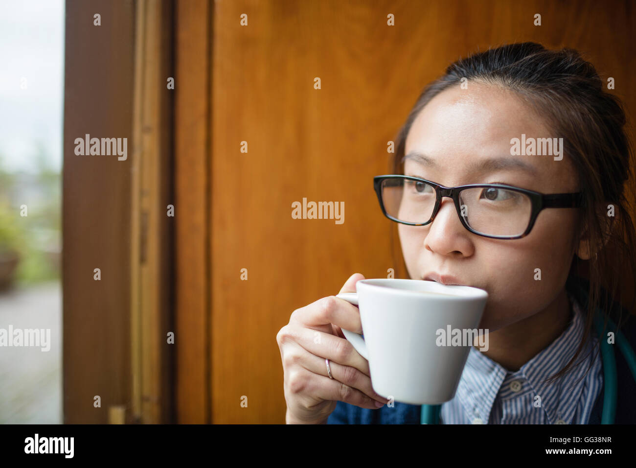 Female doctor having tea in clinic Stock Photo - Alamy