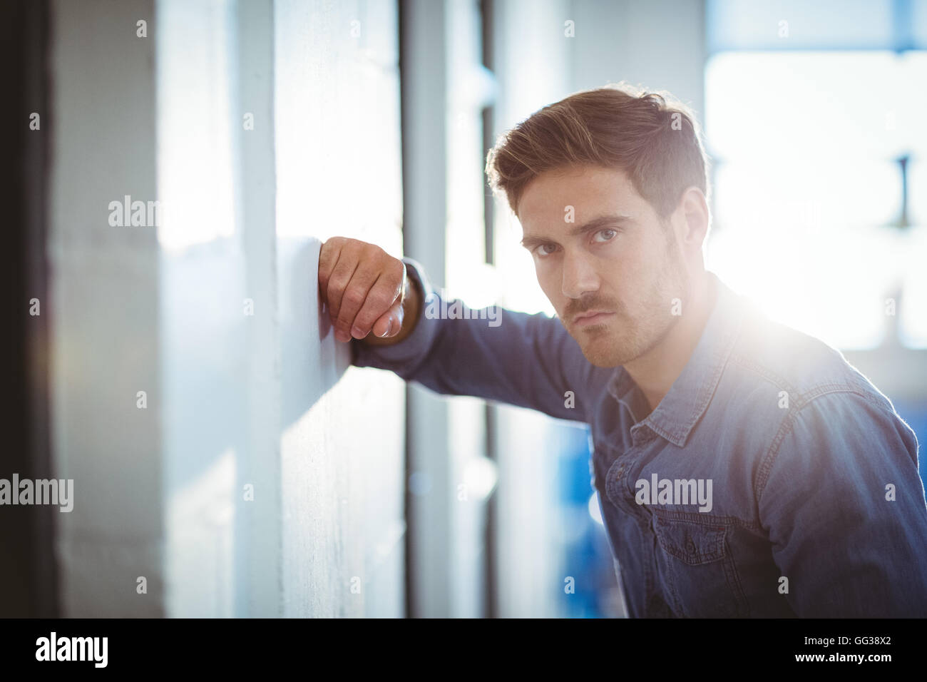 Tired man leaning wall hi-res stock photography and images - Alamy