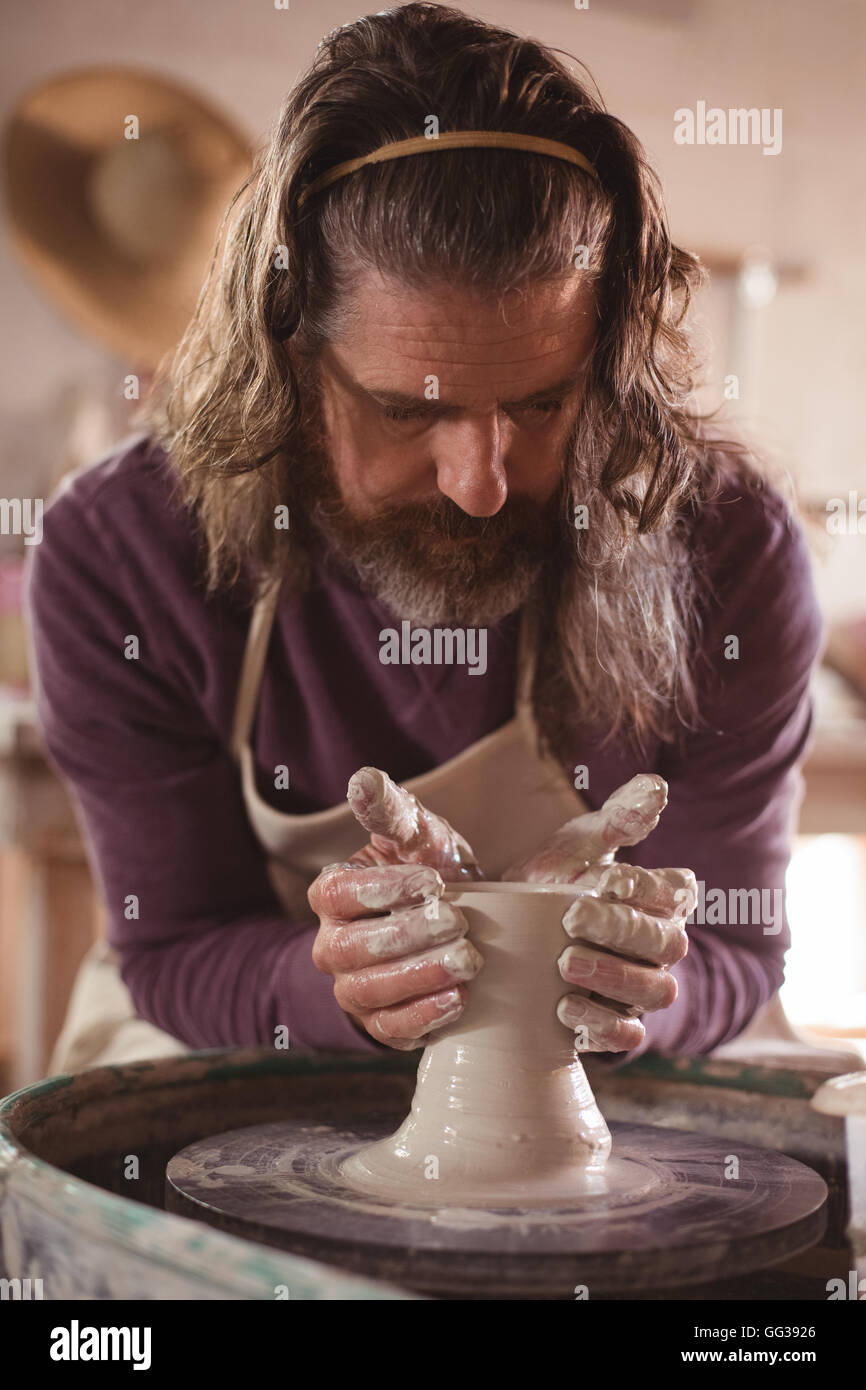 Male potter making pot Stock Photo - Alamy