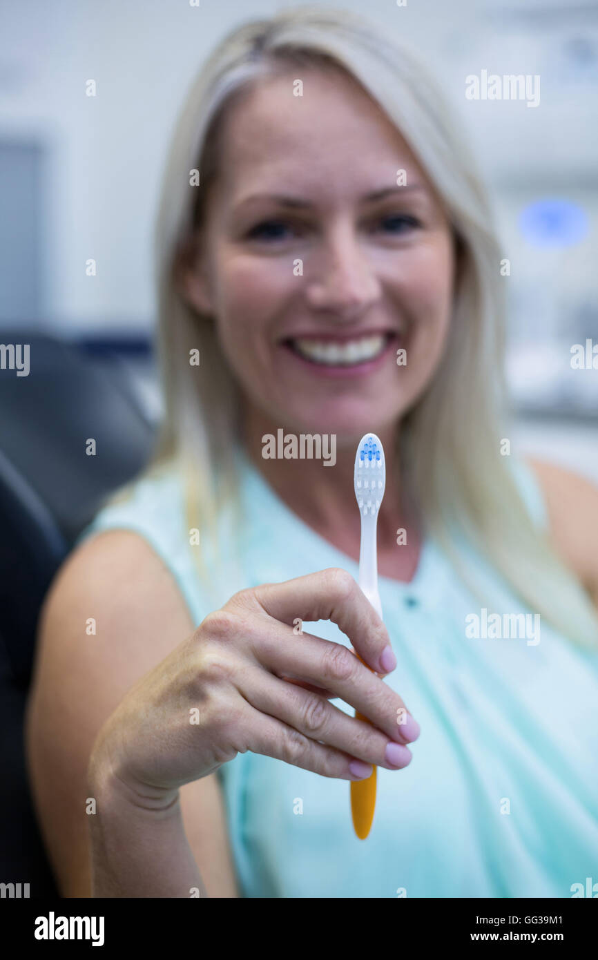 Holding tooth hi-res stock photography and images - Alamy