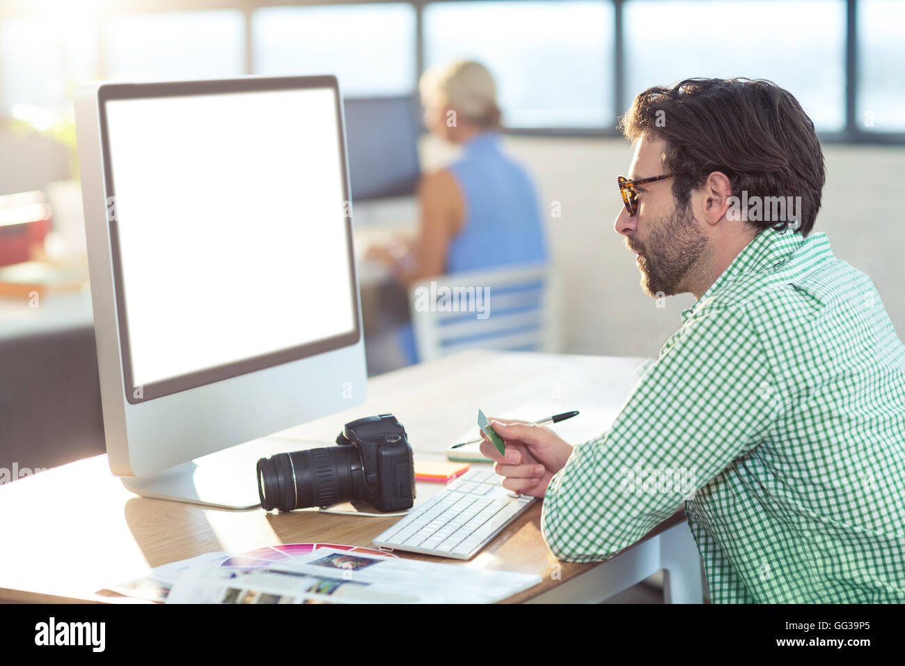 Graphic designer working on computer Stock Photo - Alamy
