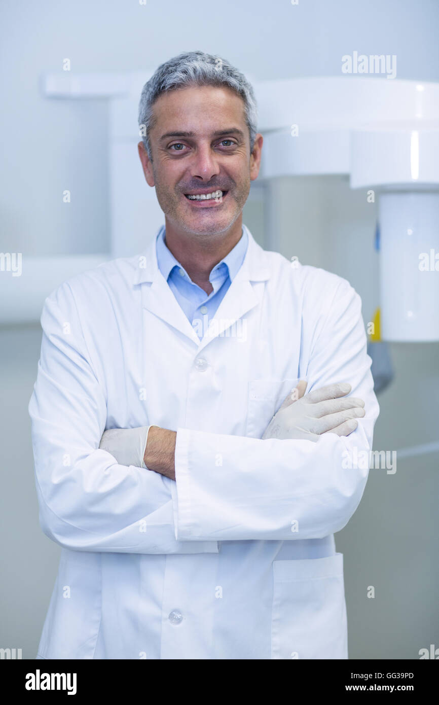 Portrait of dentist standing with arms crossed Stock Photo - Alamy