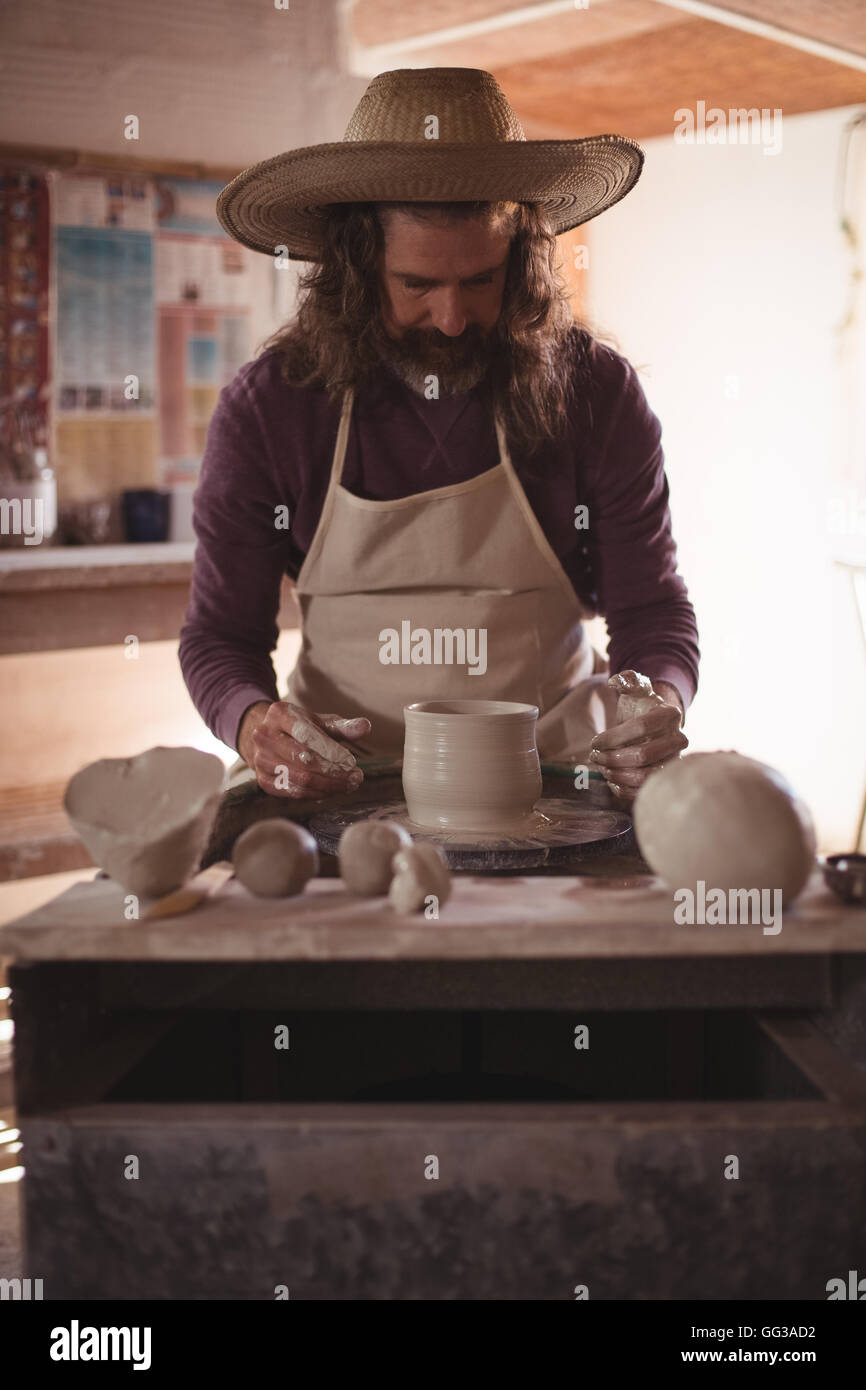 Male potter making pot Stock Photo - Alamy