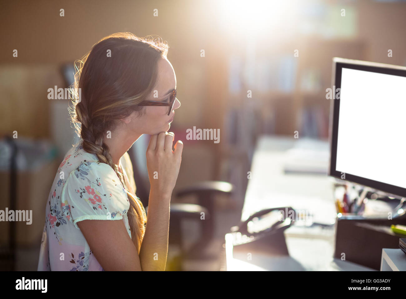 Woman working on computer Stock Photo - Alamy