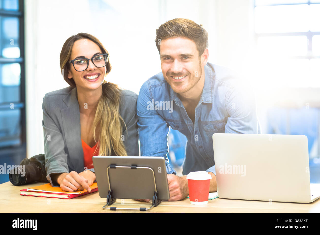 Business people smiling in office Stock Photo - Alamy