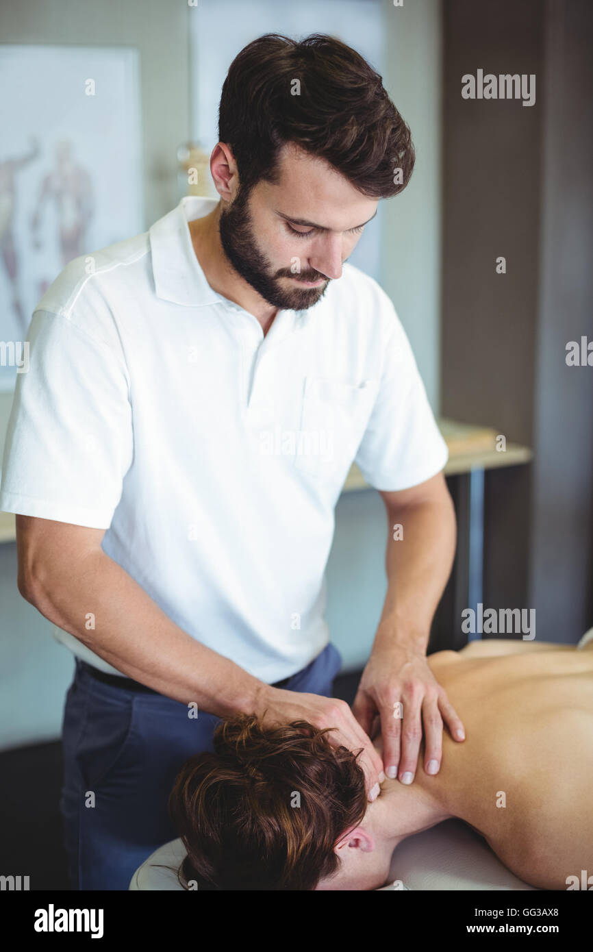 Man giving woman a neck massage hi-res stock photography and images - Alamy