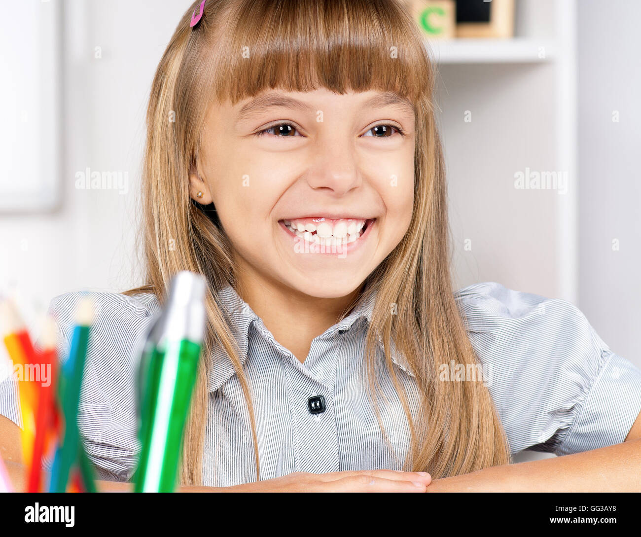 Happy girl in school Stock Photo - Alamy