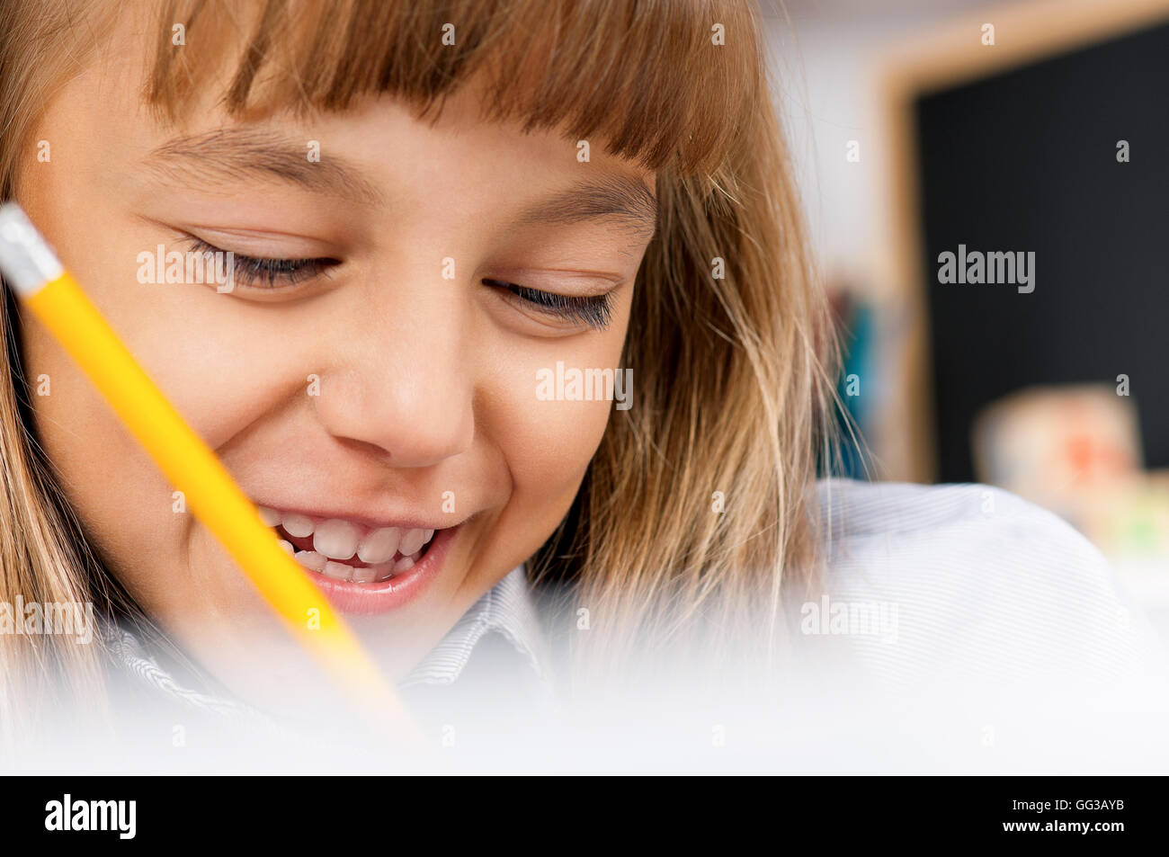Happy girl in school Stock Photo - Alamy