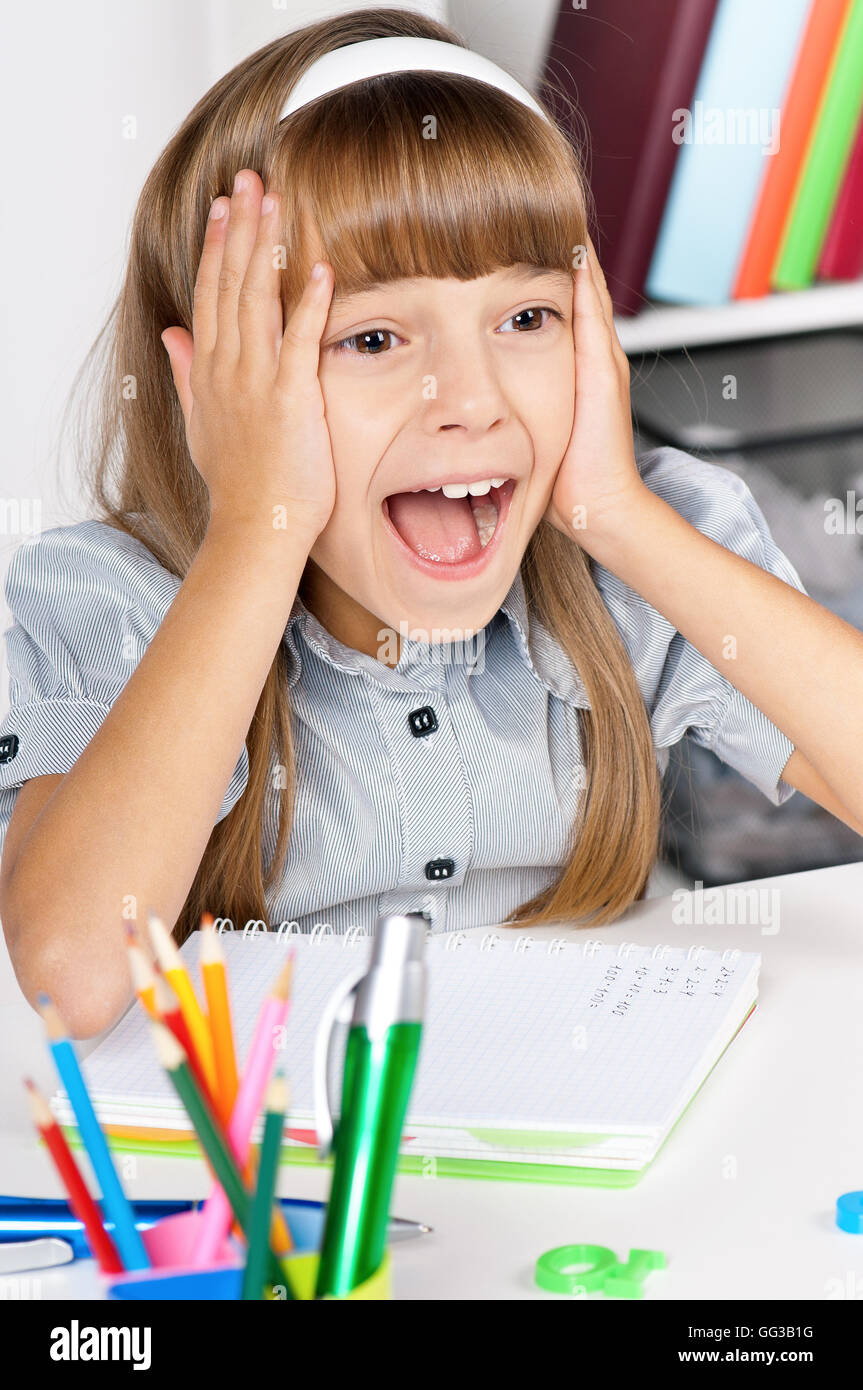 Shocked cute pupil in classroom hi-res stock photography and images - Alamy