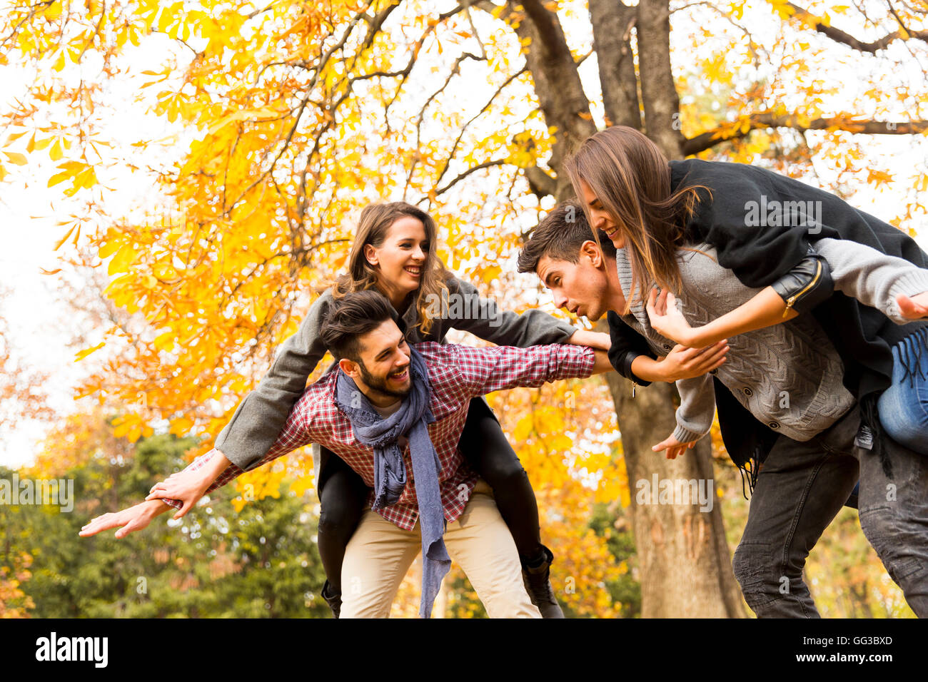 Young people having fun in the autumn park Stock Photo - Alamy