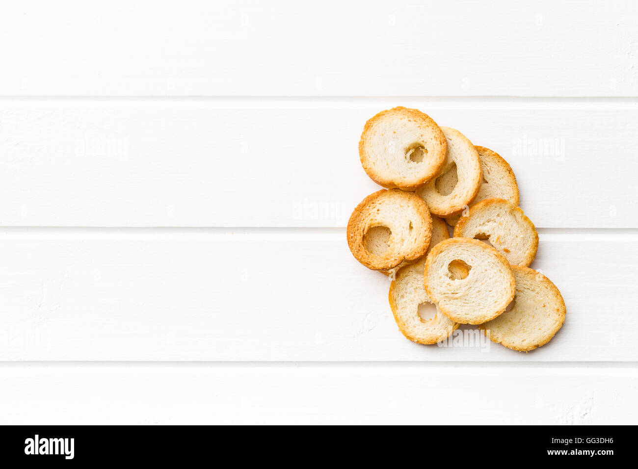The mini bread chips on white table Stock Photo - Alamy