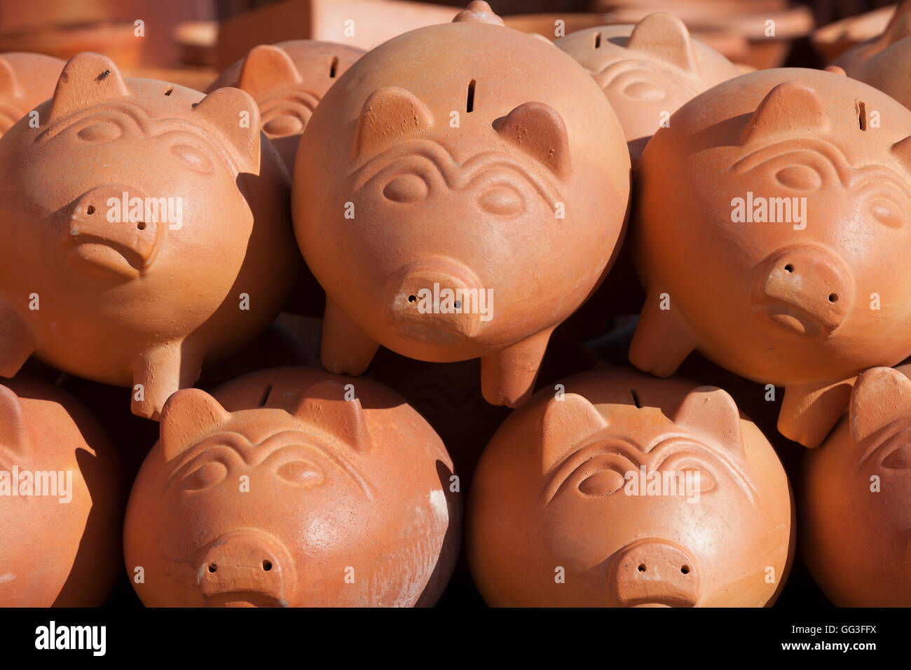 Orange clay piggy banks hi-res stock photography and images - Alamy