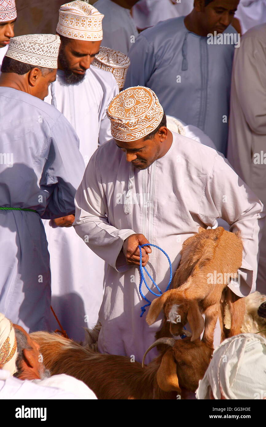 Omani men traditionally dressed attending the Goat Market in Nizwa ...